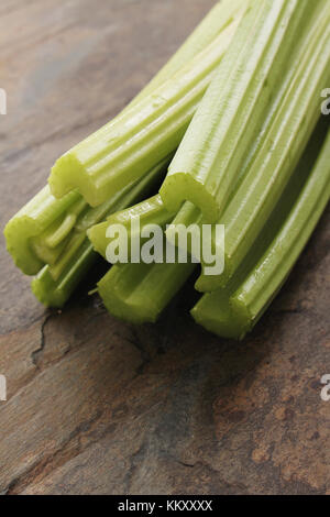 fresh cellery sticks on slate background Stock Photo - Alamy