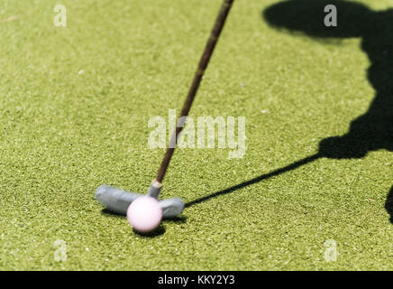 miniature golf racket and a shadow of the player Stock Photo - Alamy