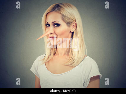 Happy liar woman with long nose Stock Photo - Alamy