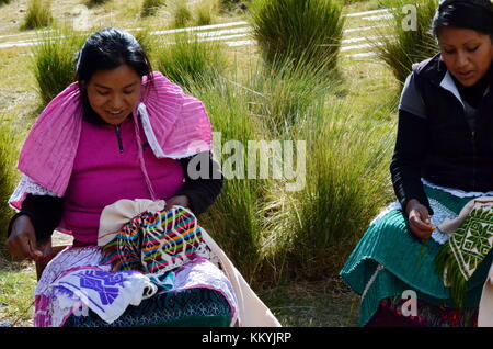 Mexican indigenous women hand sewing colorful textiles in Mexico Stock ...