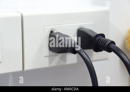 White electric plugs on wall background,White outlet interior, interior ...