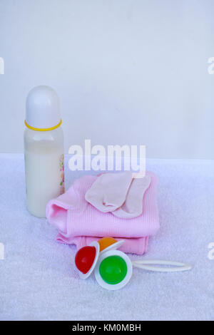 Baby clothes and socks on color background Stock Photo - Alamy