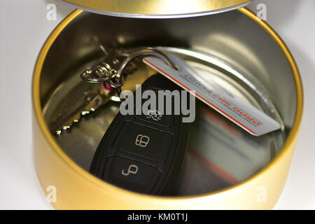 Car keys in a Tin - blocking the signal - Faraday cage Stock Photo - Alamy
