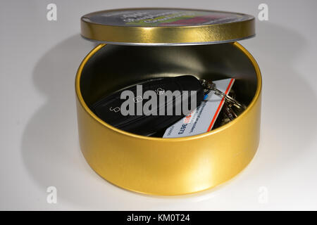 Car keys in a Tin - blocking the signal - Faraday cage Stock Photo - Alamy