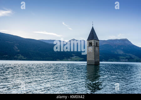 Church under water, drowned village, mountain landscape and peaks in ...