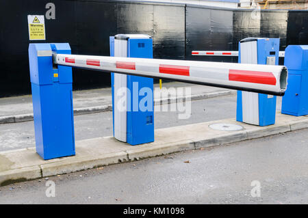 Car park entrance barrier and ticket machine barrier down blocking ...