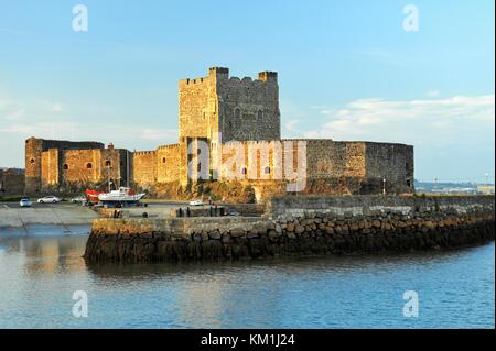 Carrickfergus Castle built by John de Courcy in 1177 and the harbour ...