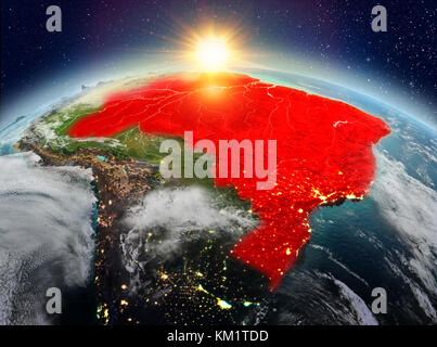 Satellite view of Brazil highlighted in red on planet Earth with clouds ...
