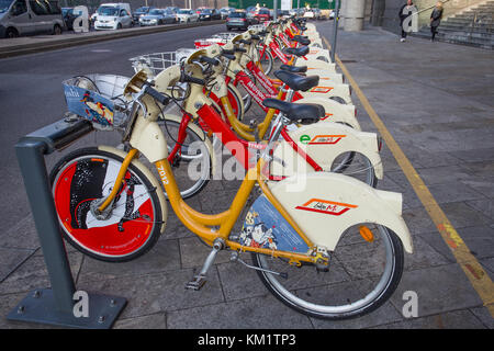 Bike sharing service racks in Milan, Italy Stock Photo - Alamy