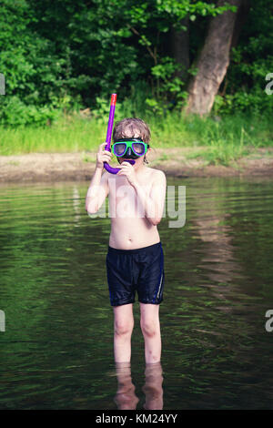 Young boy diving in the river Ganges at Varanasi Stock Photo - Alamy