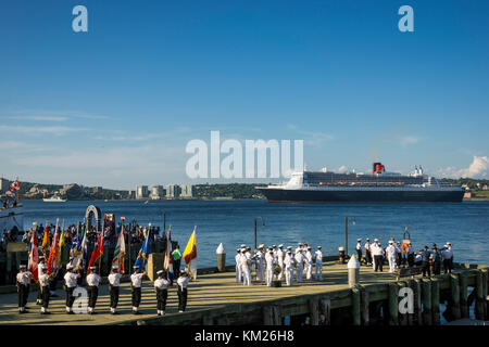 A military band and cadets from HMCS ACADIA salute Queen Mary II ...