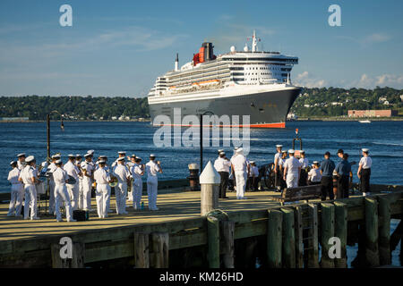 A military band and cadets from HMCS ACADIA salute Queen Mary II ...