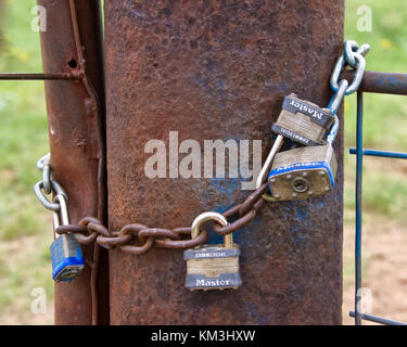 Locks on a ranch gate Stock Photo - Alamy