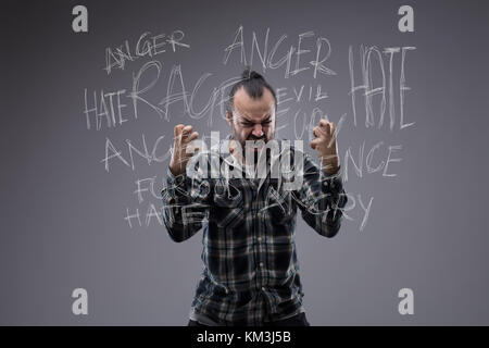 Angry revengeful man in a fit of rage Stock Photo - Alamy