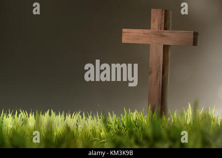 Christian cross on the green grass with sunlight background Stock Photo ...