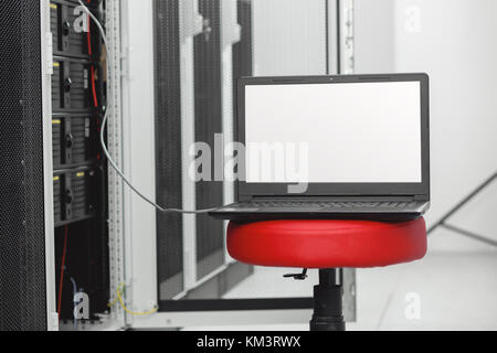 blank displays and laptop in a large server room Stock Photo - Alamy