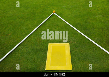 A lawn bowls mat and ball on the lawn Stock Photo - Alamy