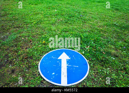 Blue round sign with white arrow pointing up or forward, meaning right ...