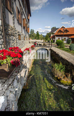 Hotel Gacka in Lika County near Otocac, Croatia. A water channel with ...