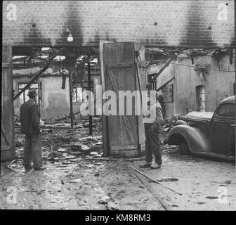 This image depicts the aftermath of a bomb raid during the Blitz ...