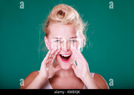 Yelling gestures concept. Lovely pin up girl screaming with hands close ...