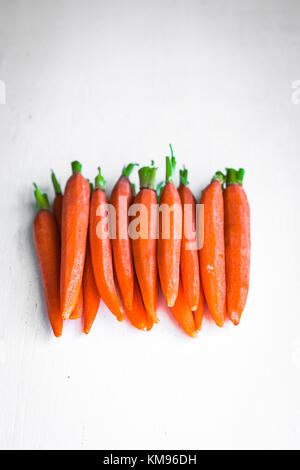 Farm raised baby carrots Stock Photo - Alamy