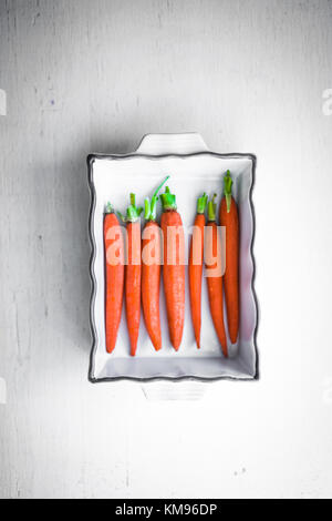 Farm raised baby carrots Stock Photo - Alamy