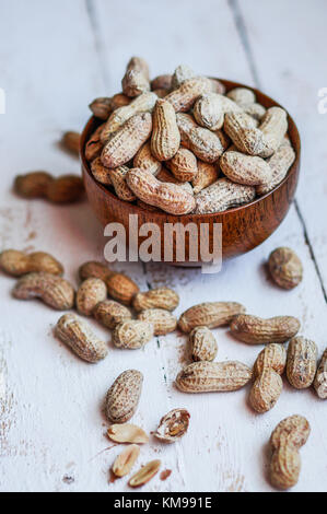 Roasted Peanuts On White Wooden Background Stock Photo - Alamy
