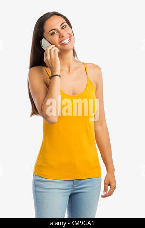 Young beautiful hispanic woman talking on smartphone holding credit ...