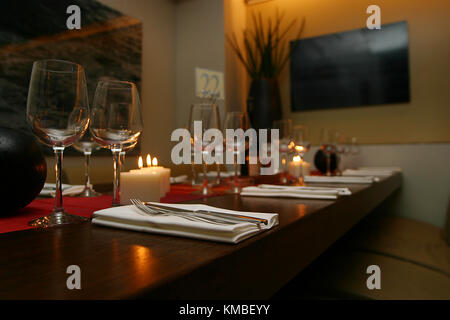 A bar in the restaurant is prepared for the arrival of diners, set up ...