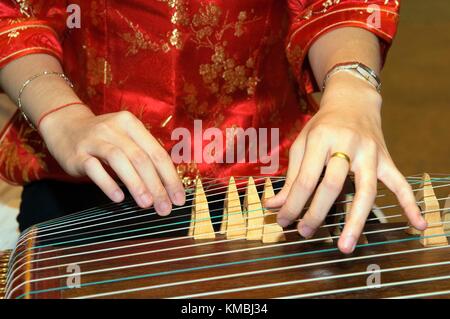 Playing the ancient stringed instrument Stock Photo - Alamy