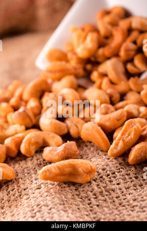 Pile of roasted cashew nuts splashed on the table Stock Photo - Alamy