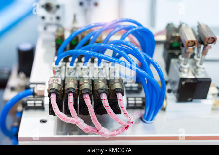 Industrial equipment with pneumatic valves, hoses, and gauges ...
