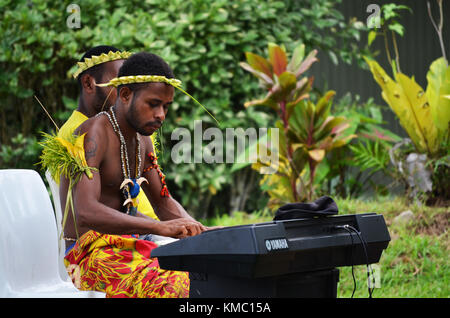 Islanders singing and playing musical instruments taken at Papua New ...