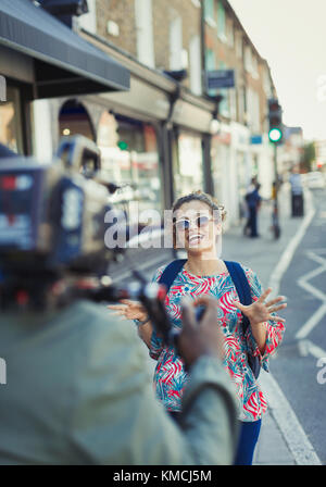Young urban woman standing and posing, studio shot Stock Photo - Alamy