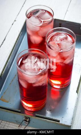 Wild rose cocktail . Three berry cocktail with liquor and ice . Top ...