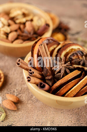 Closeup of aromatic dried anise stars with seeds scattered on rustic ...