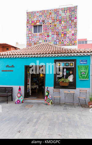 Patchwork crochet wall hanging on outside upstairs wall above a craft ...