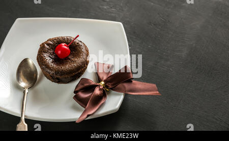 Fondant decorated with cocktail cherry Stock Photo - Alamy