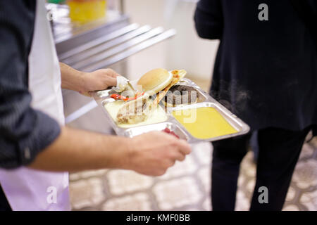 A person is having lunch at a cafeteria for poor people Stock Photo - Alamy