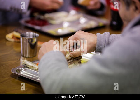 A person is having lunch at a cafeteria for poor people Stock Photo - Alamy