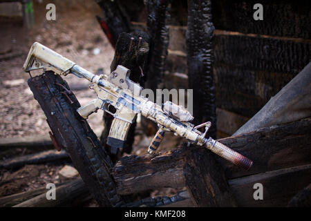 Assault Rifle, painted in sand color on a green background. Airsoft ...