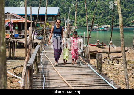 Moken sea gypsy family in a small island village off the coast of south ...