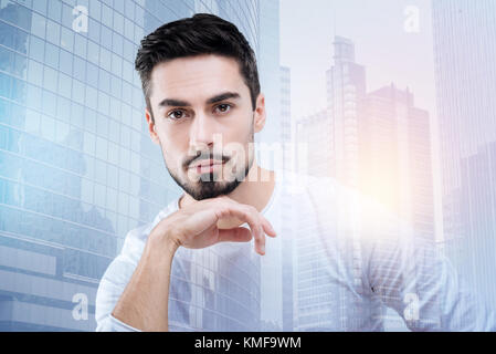 Thoughtful man sitting quietly Stock Photo - Alamy