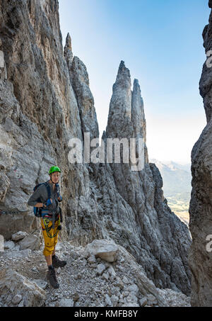Hiker on the Santner via ferrata, Rosengarten Group, Dolomites, South ...