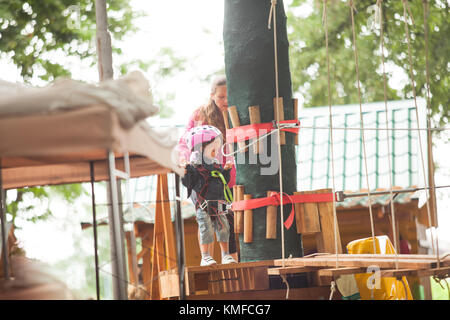 The obstacle course in adventure park Stock Photo - Alamy