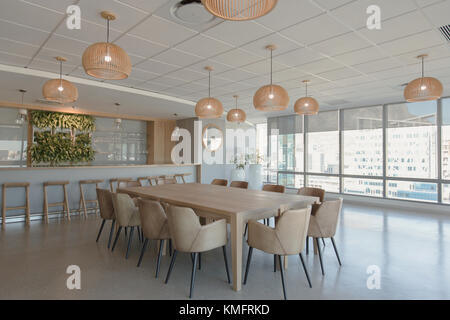Conference table and pendant lights in modern office conference room ...