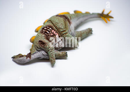 dinosaur dead body on a white background Stock Photo - Alamy