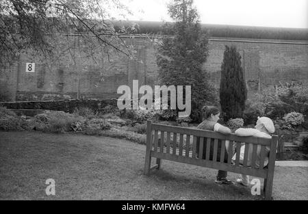 Two female inmates relaxing in grounds of HMP Winchester, Winchester ...