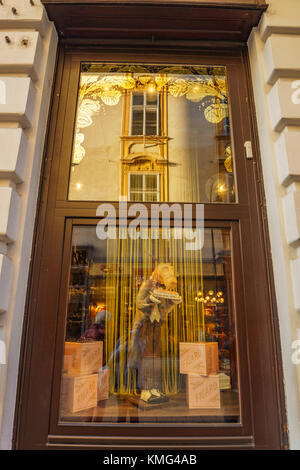 Colorful illuminated store fronts and shops in the city center of ...